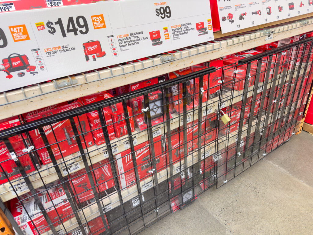 Locked power tools on display inside a Home Depot store. Shoplifting ...