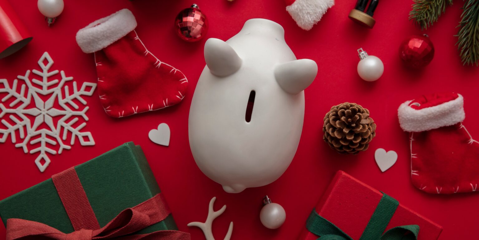 Festive Christmas financial savings concept. White piggy bank money box ...